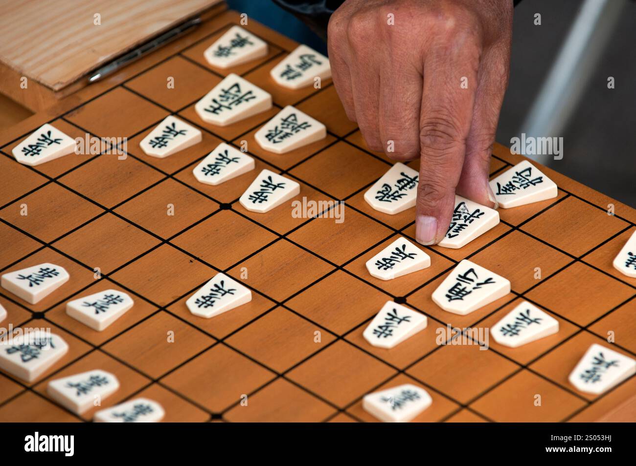 Competitors challenging each other to a strategy board game called ...