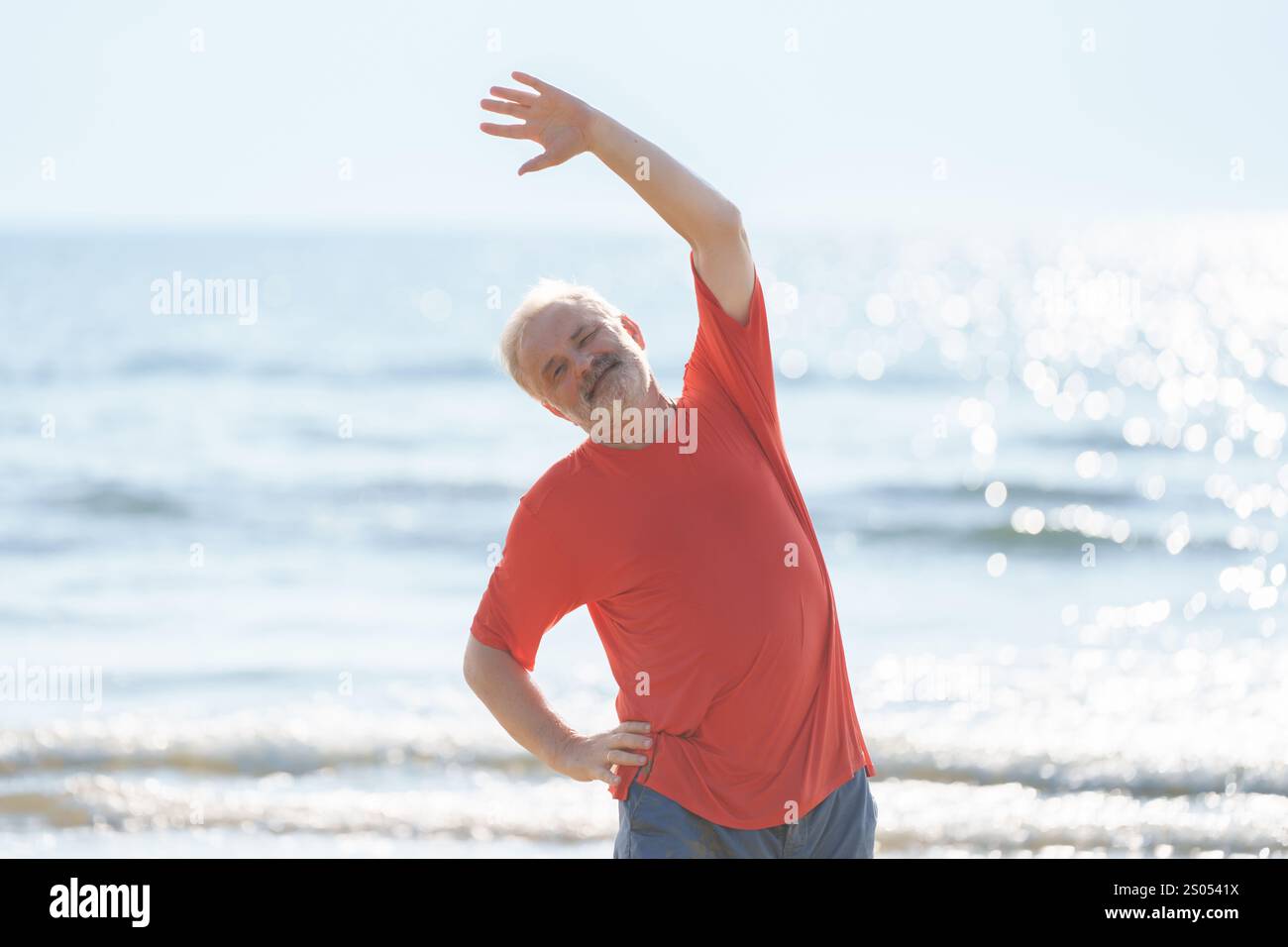 Senior man running on tropical beach. Happy active retirement. Fit ...
