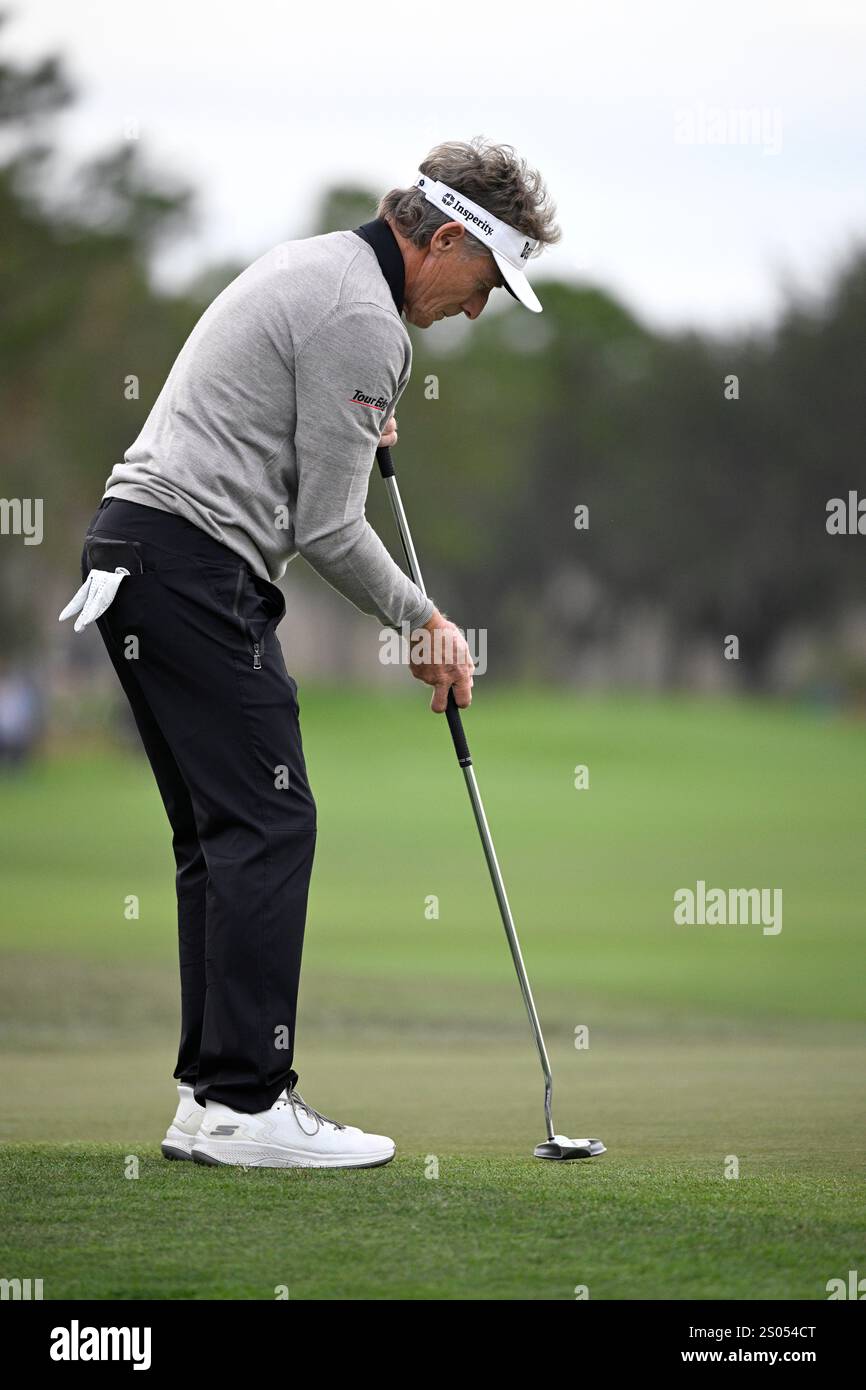 Bernhard Langer putts on the 18th green during the final round of the ...