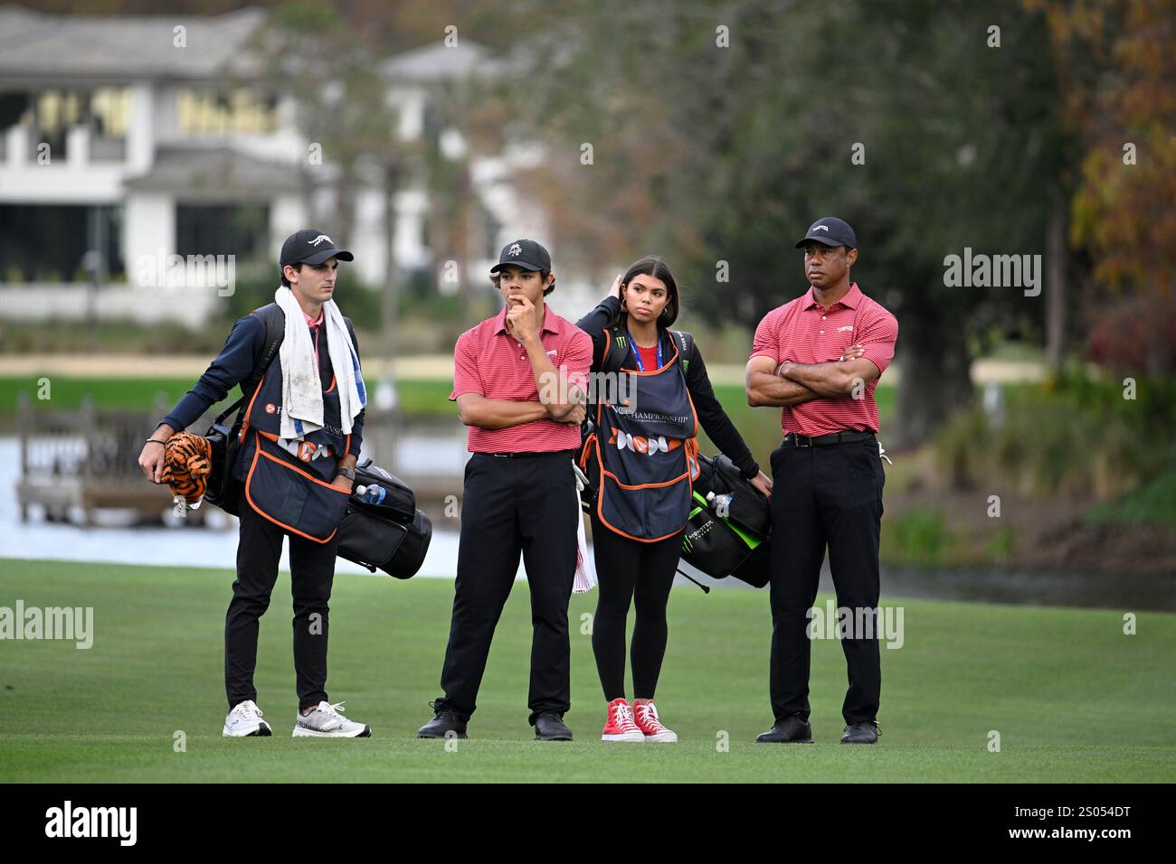 Tiger Woods, right, stands on the 18th fairway with his daughter Sam ...
