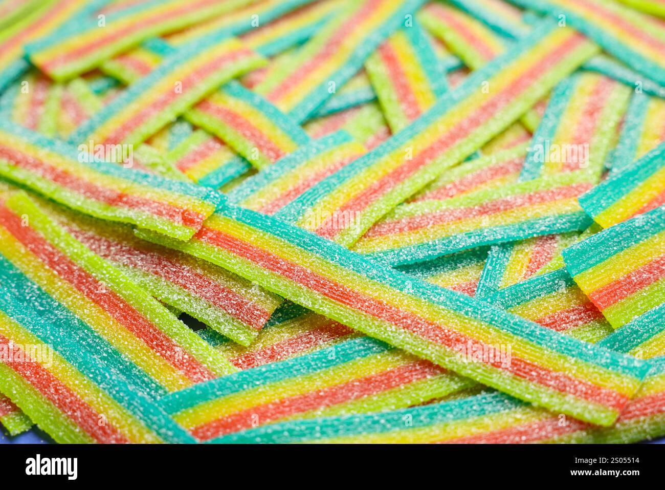 Tasty rainbow sour belts as background, closeup Stock Photo - Alamy