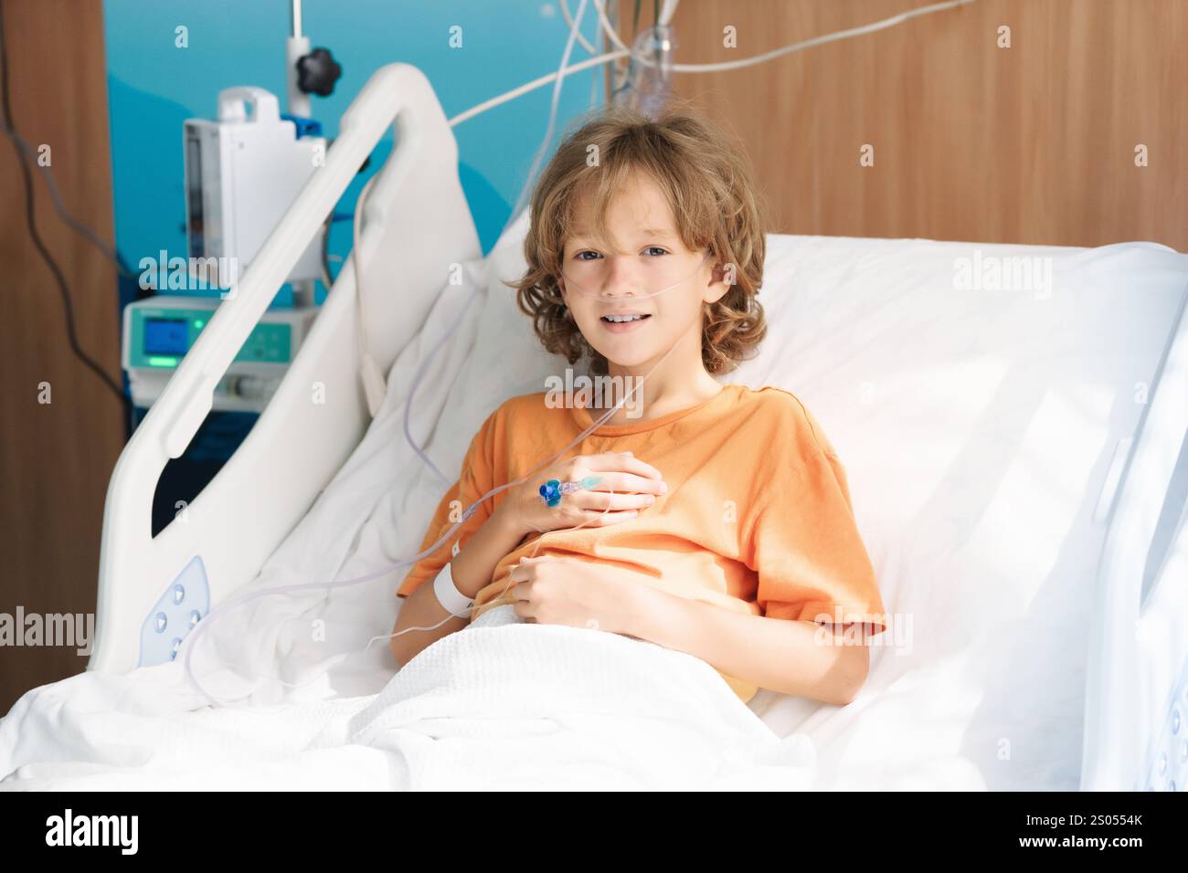 Sick child in hospital room. Kid in clinic ward. Little boy with oxygen ...
