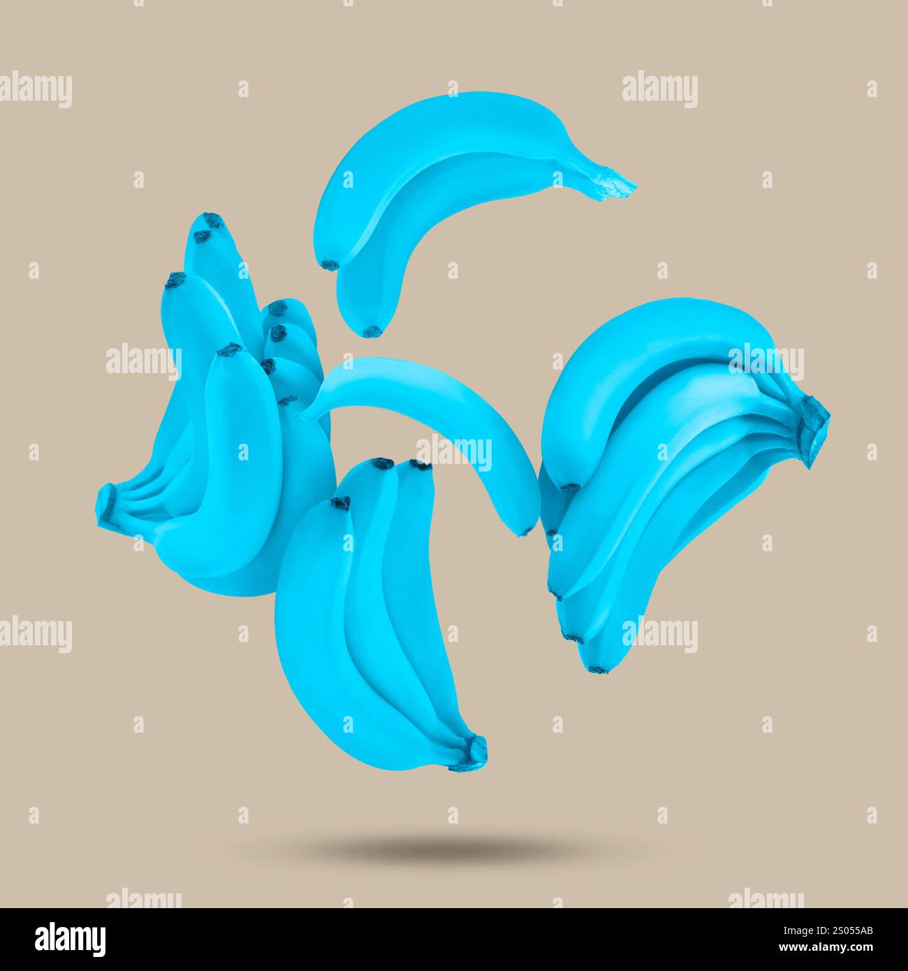 Light blue bananas in air on beige grey background Stock Photo - Alamy