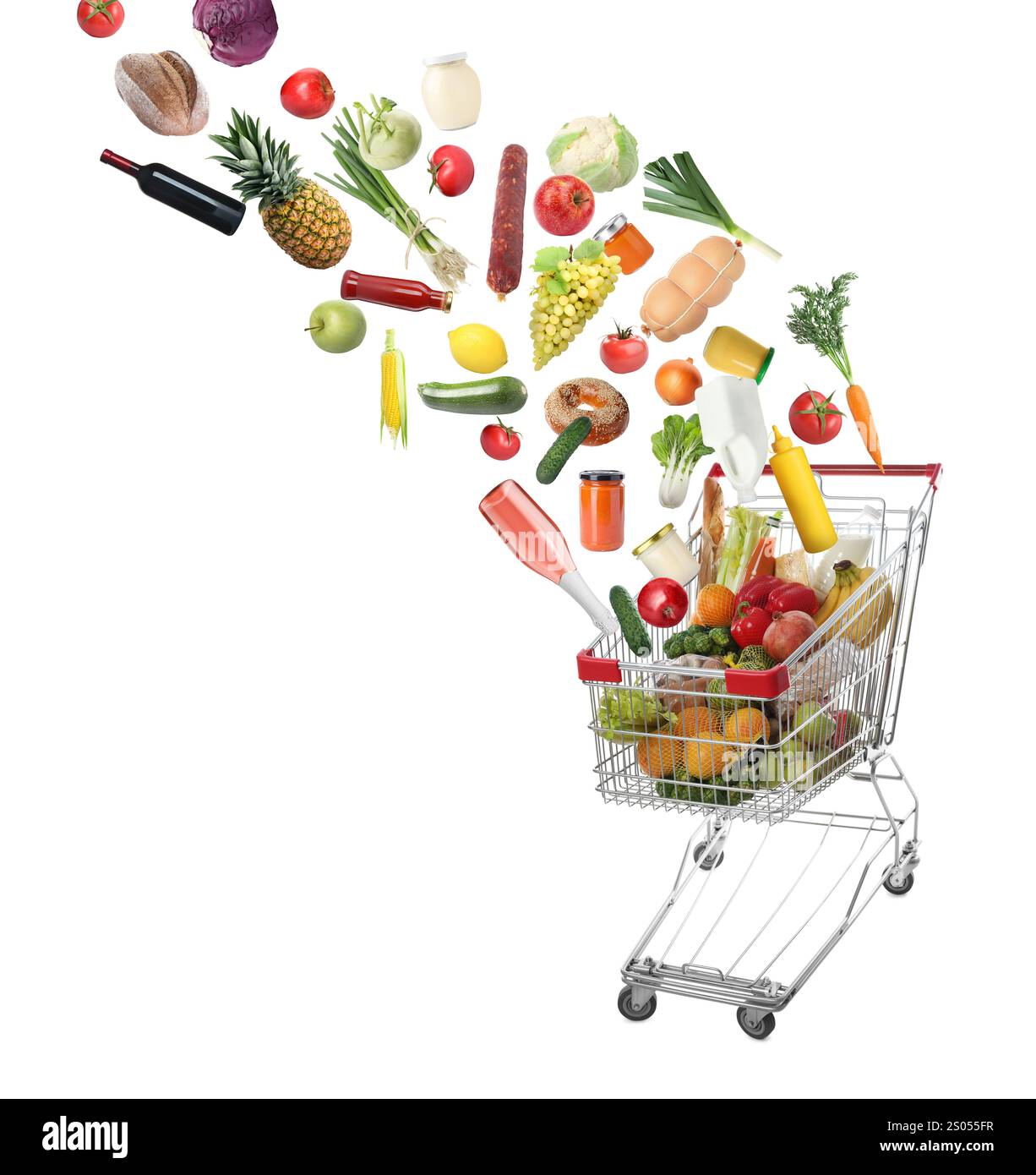 Many different products falling into shopping cart on white background ...