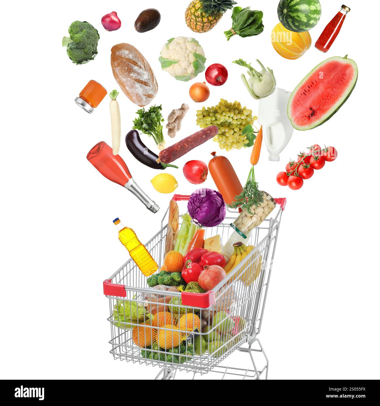 Many different products falling into shopping cart on white background ...