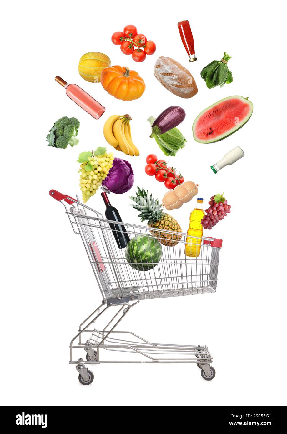 Many different products falling into shopping cart on white background ...