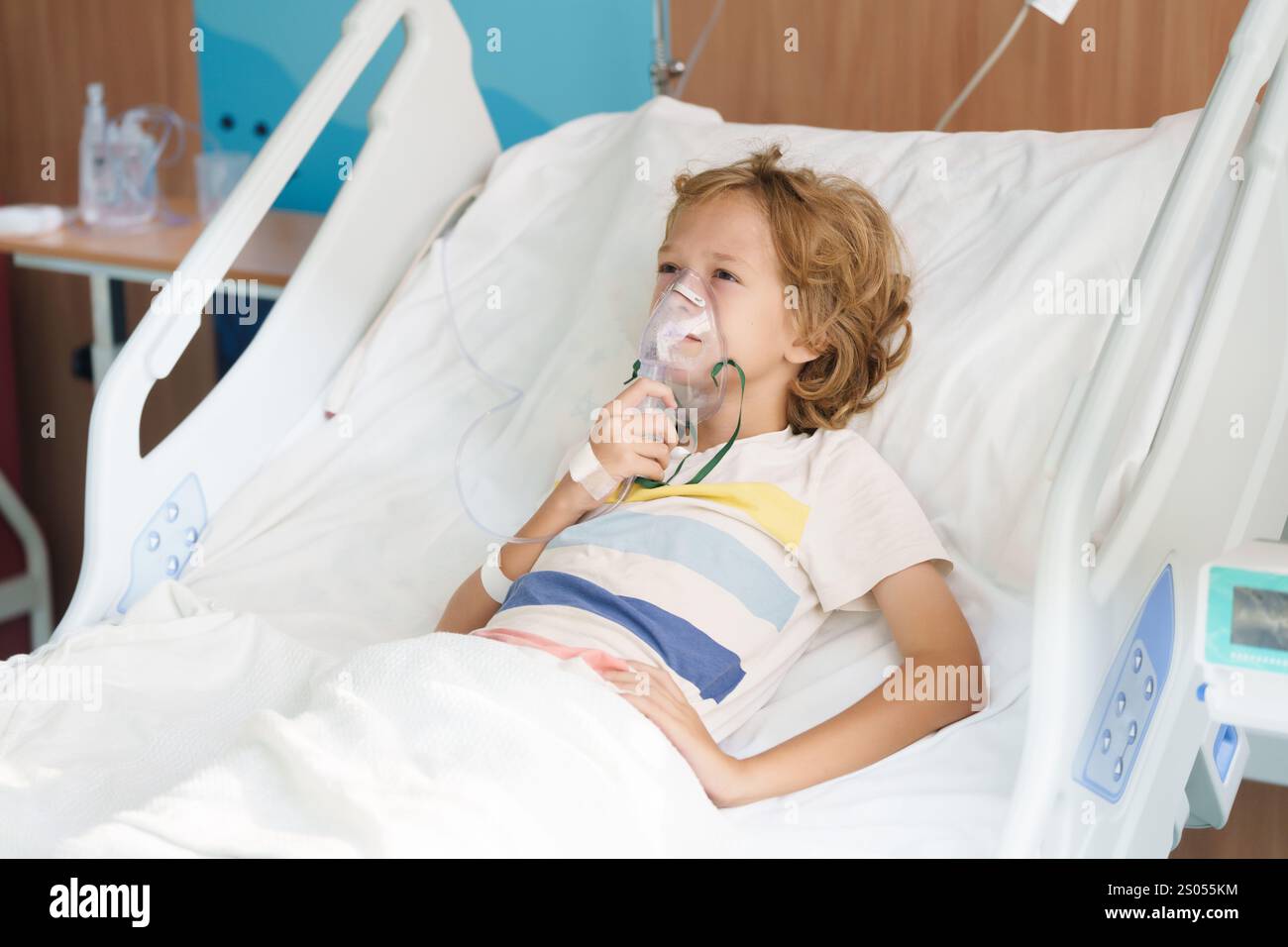 Sick child in hospital room. Kid in clinic ward. Little boy with oxygen ...
