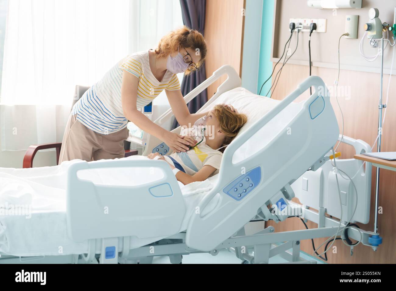 Sick child in hospital room. Kid in clinic ward. Little boy with oxygen ...