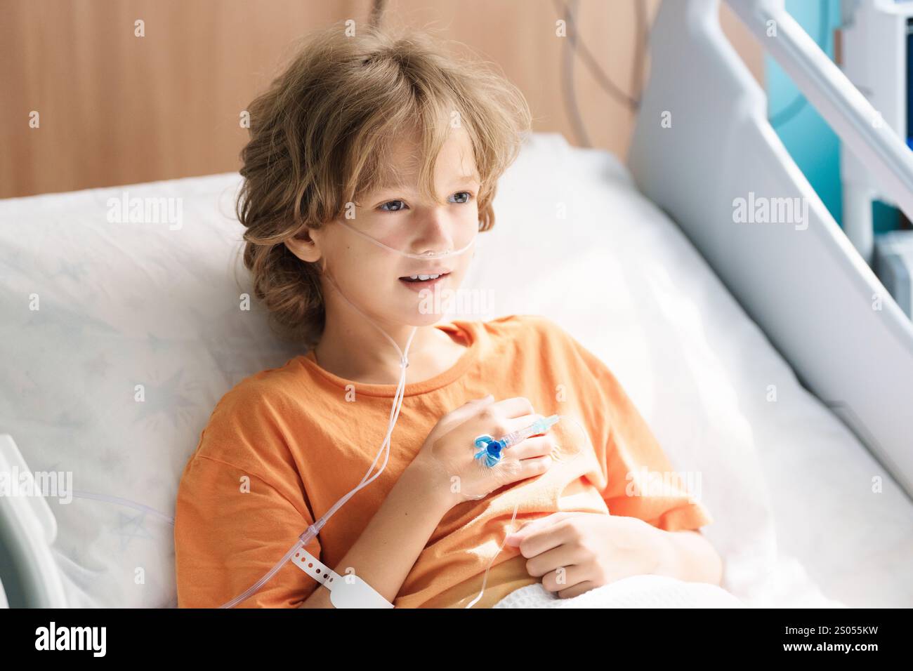 Sick child in hospital room. Kid in clinic ward. Little boy with oxygen ...