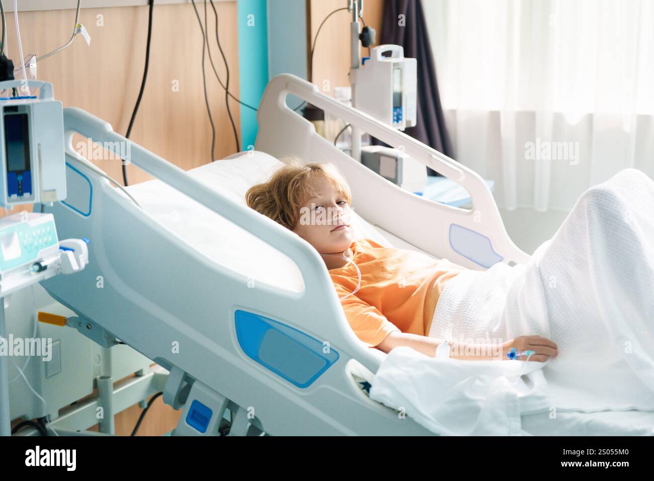 Sick child in hospital room. Kid in clinic ward. Little boy with oxygen ...