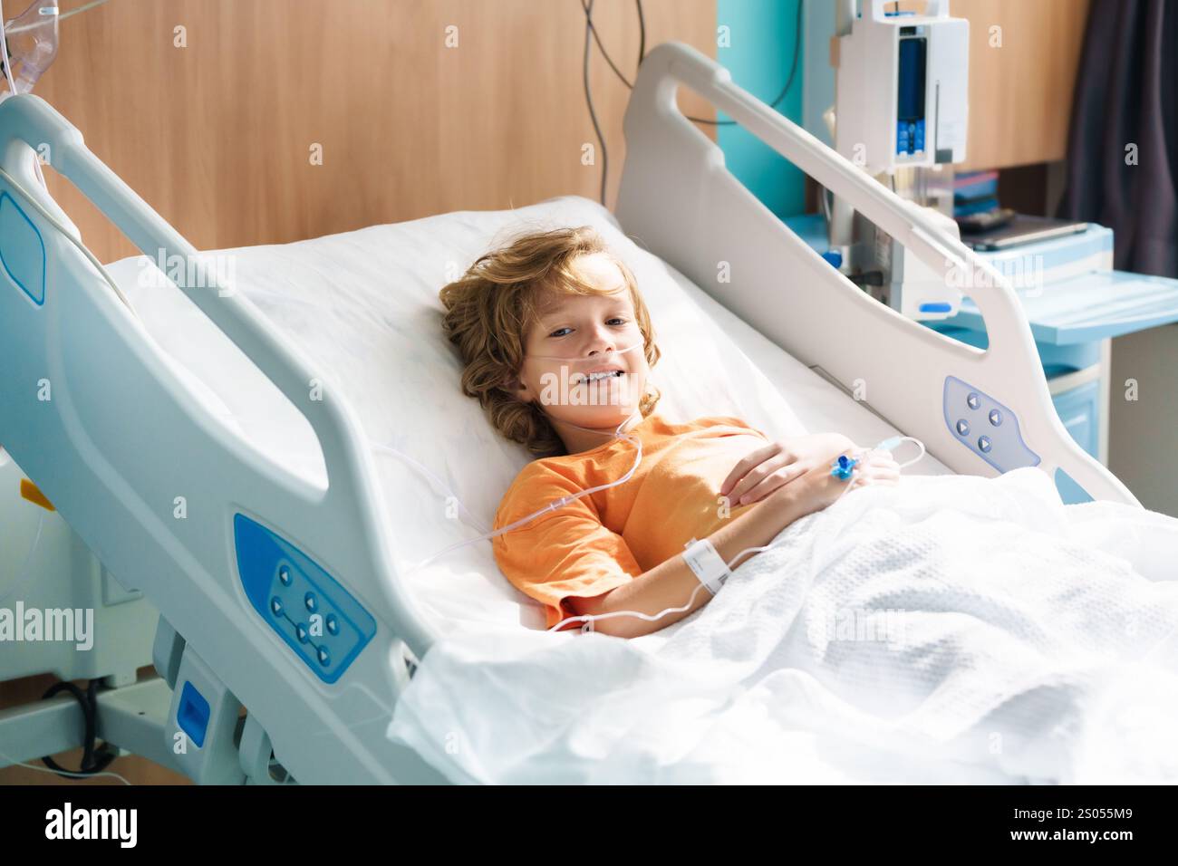 Sick child in hospital room. Kid in clinic ward. Little boy with oxygen ...