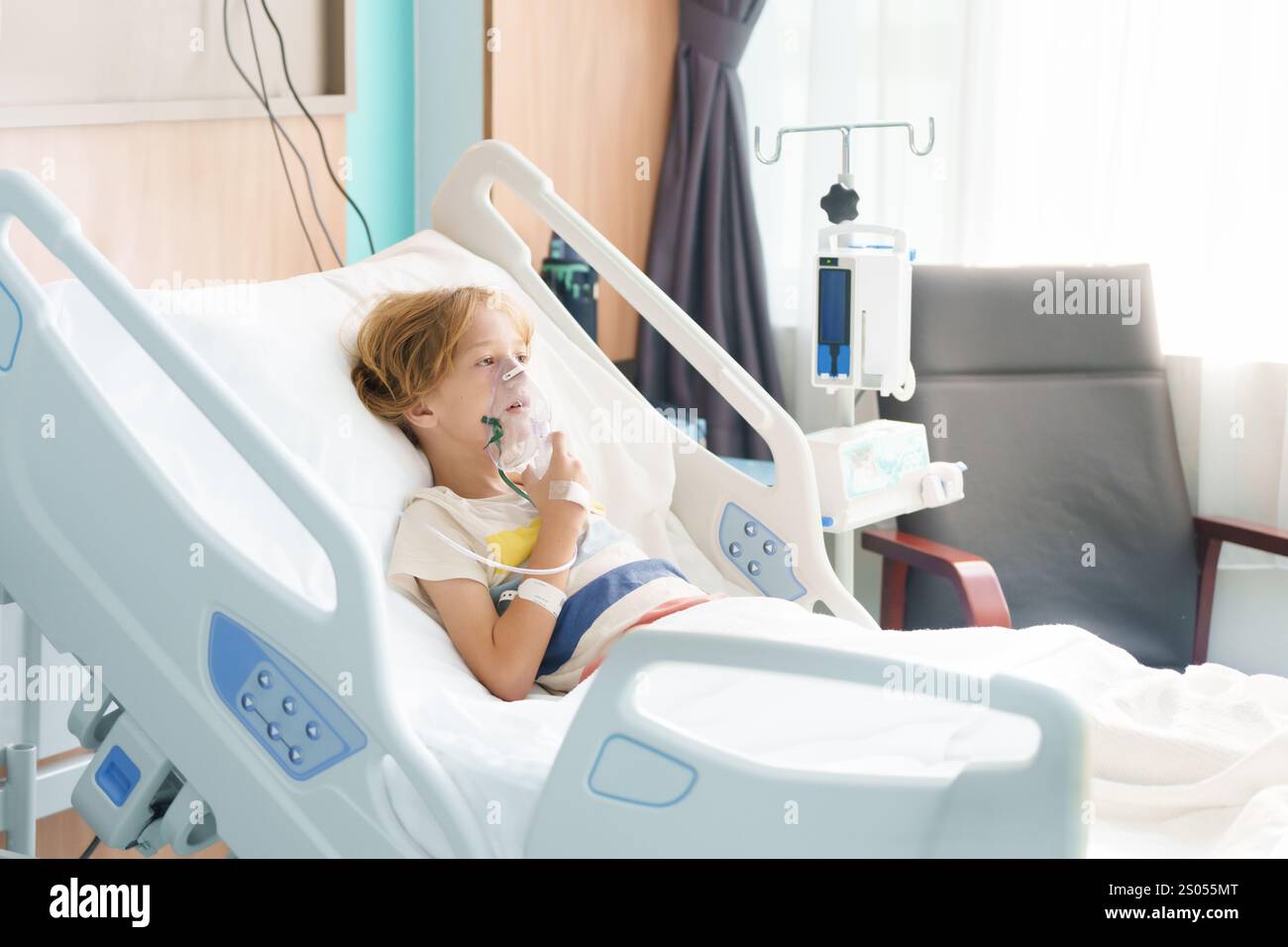 Sick child in hospital room. Kid in clinic ward. Little boy with oxygen ...