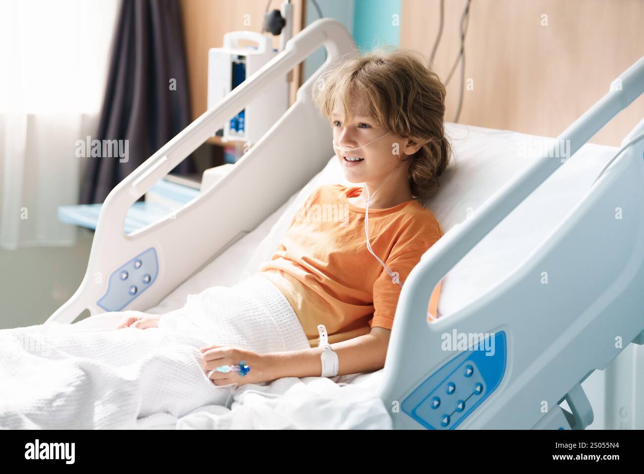 Sick child in hospital room. Kid in clinic ward. Little boy with oxygen ...