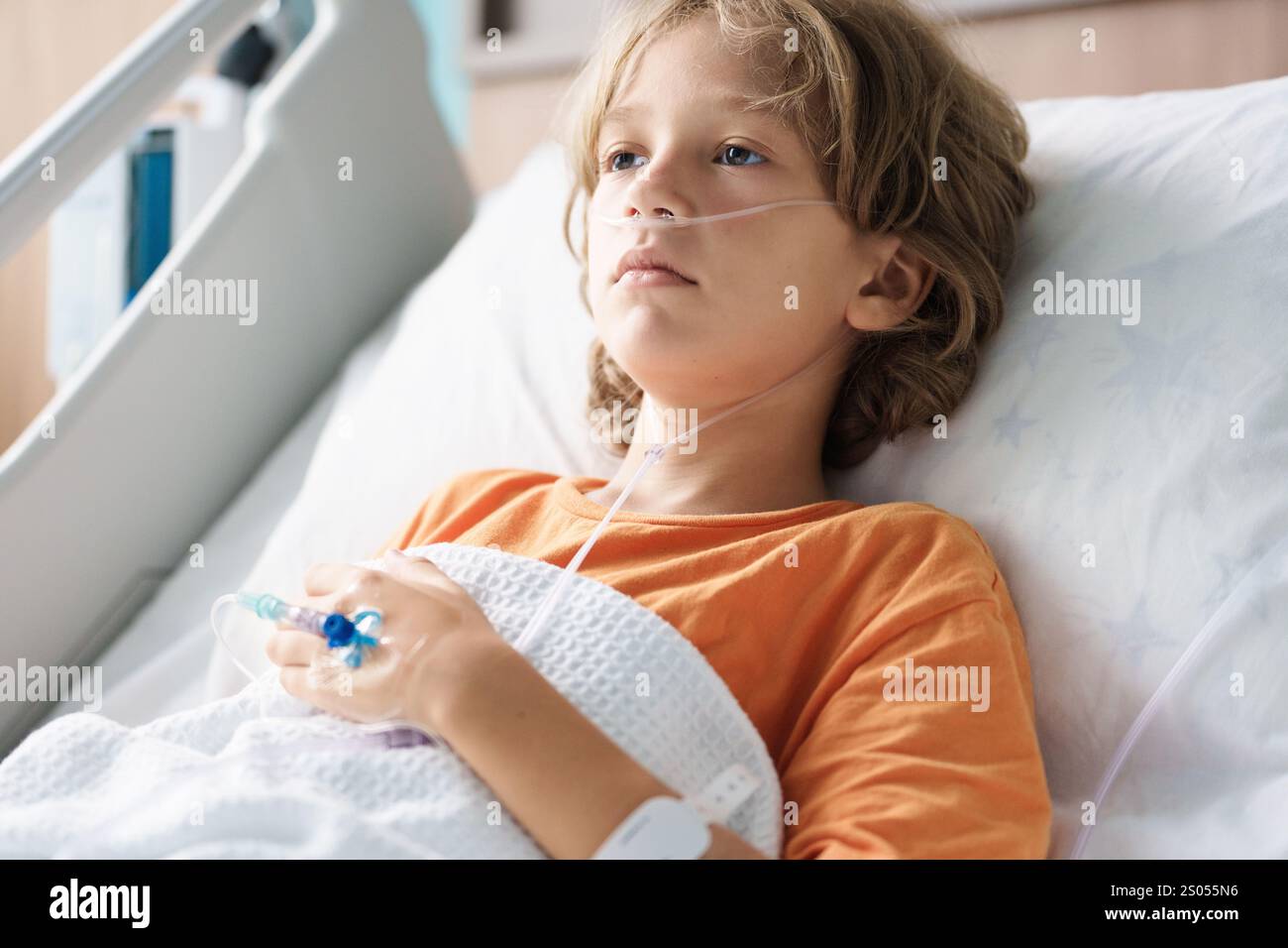 Sick child in hospital room. Kid in clinic ward. Little boy with oxygen ...