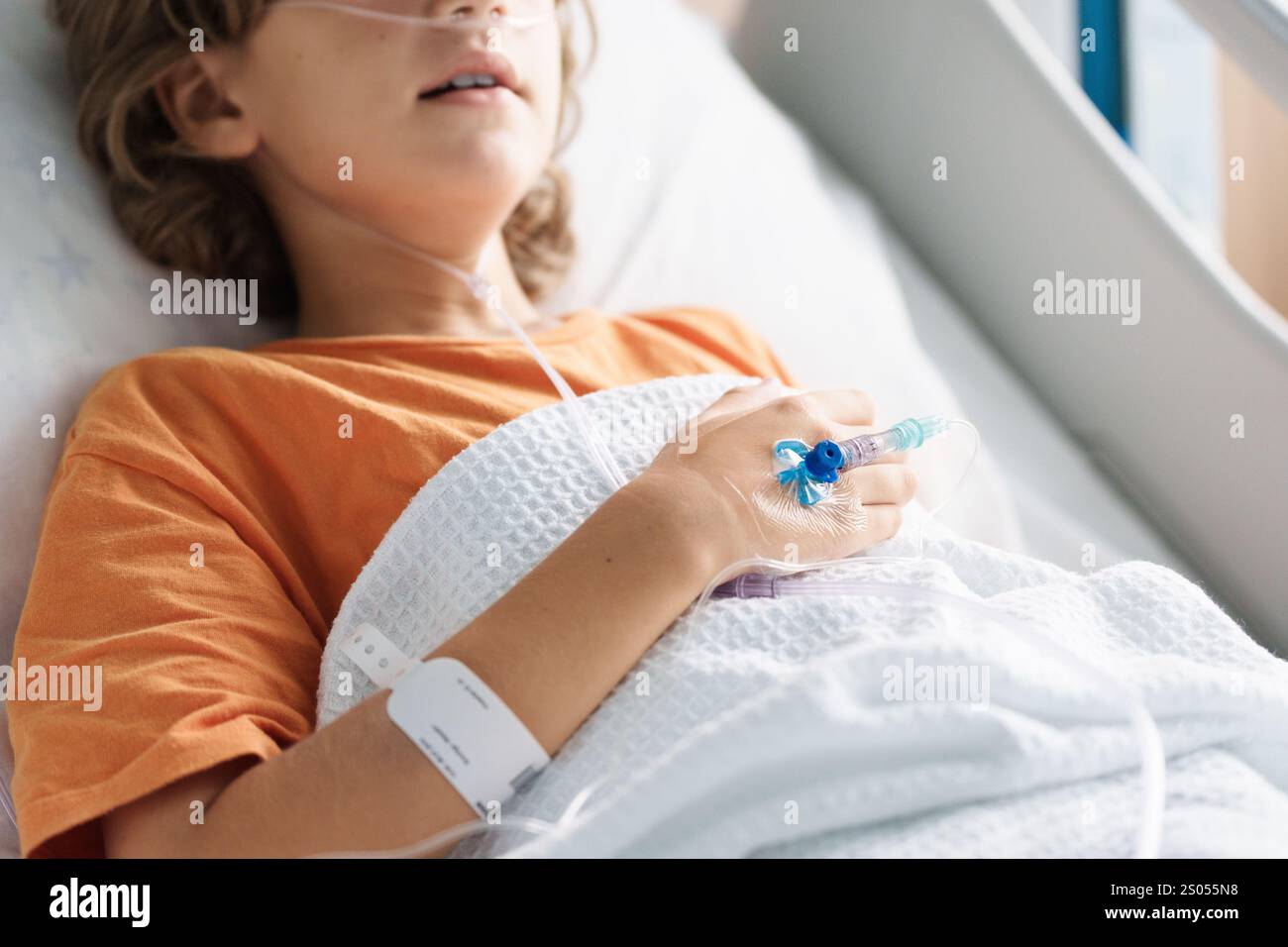 Sick child in hospital room. Kid in clinic ward. Little boy with oxygen ...