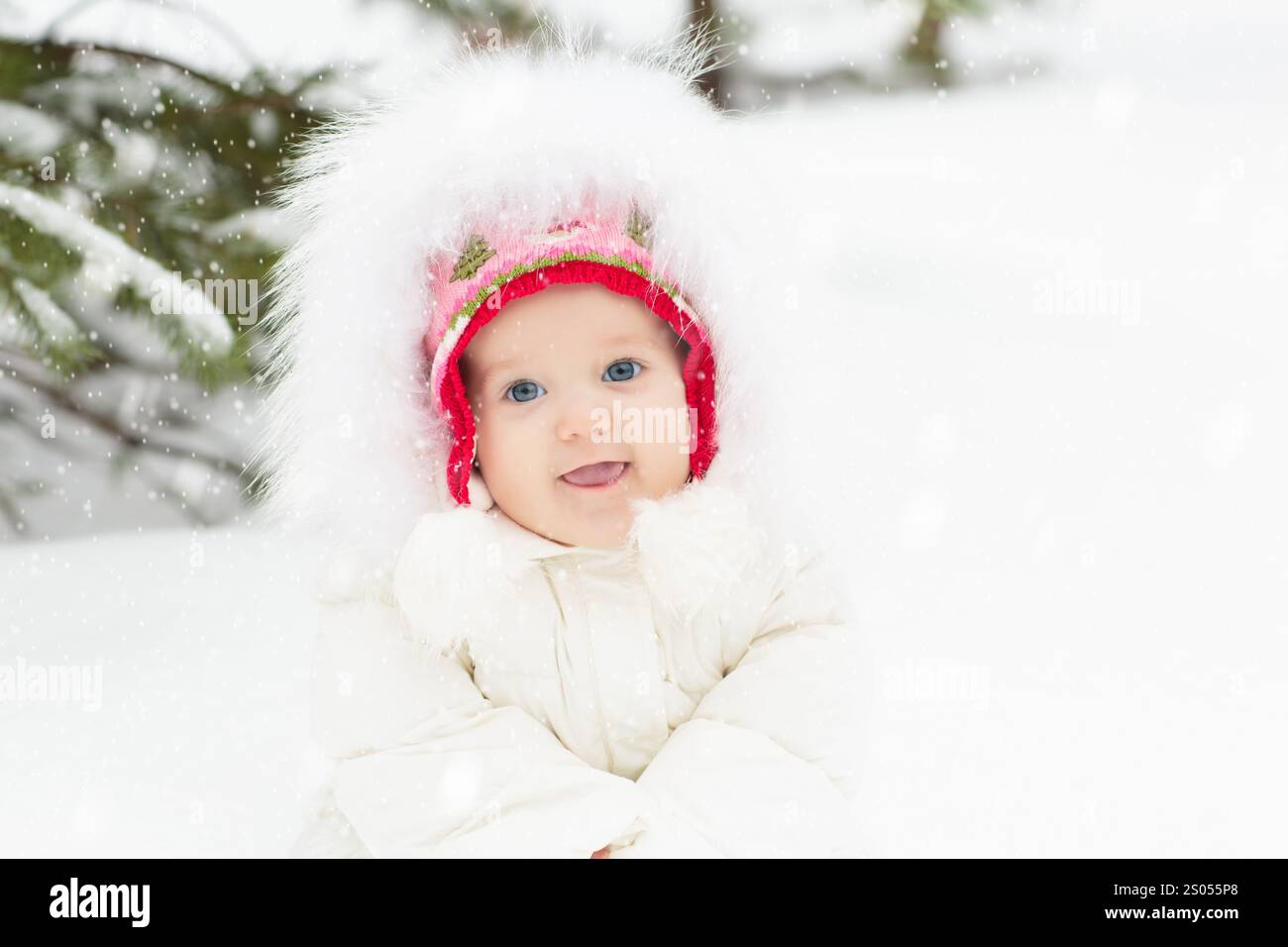 Kids play in snow in winter park. Children playing outdoors on snowy ...