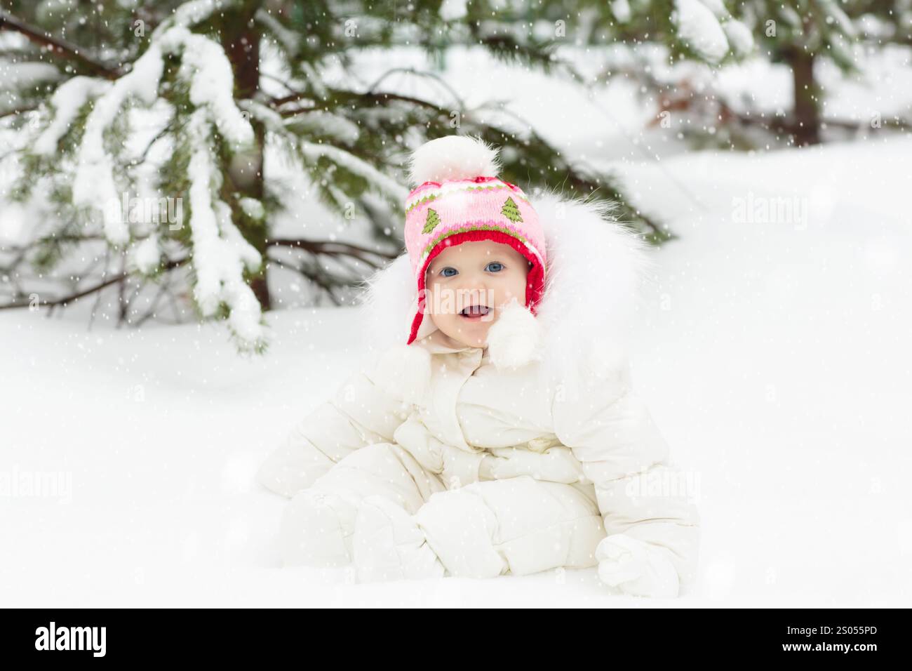 Kids play in snow in winter park. Children playing outdoors on snowy ...