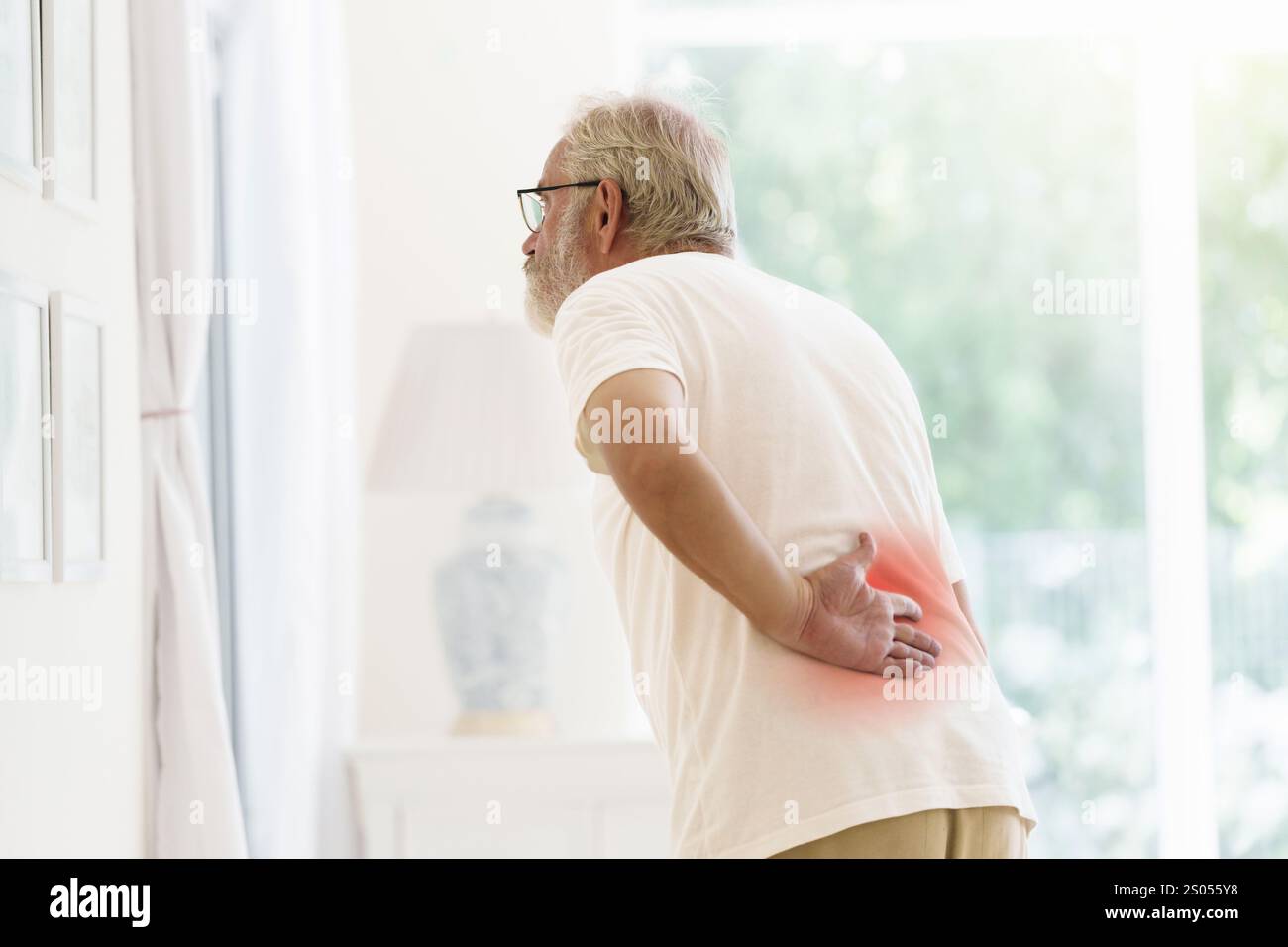 Senior man in pain. Retired man suffering from chest, back and stomach ...