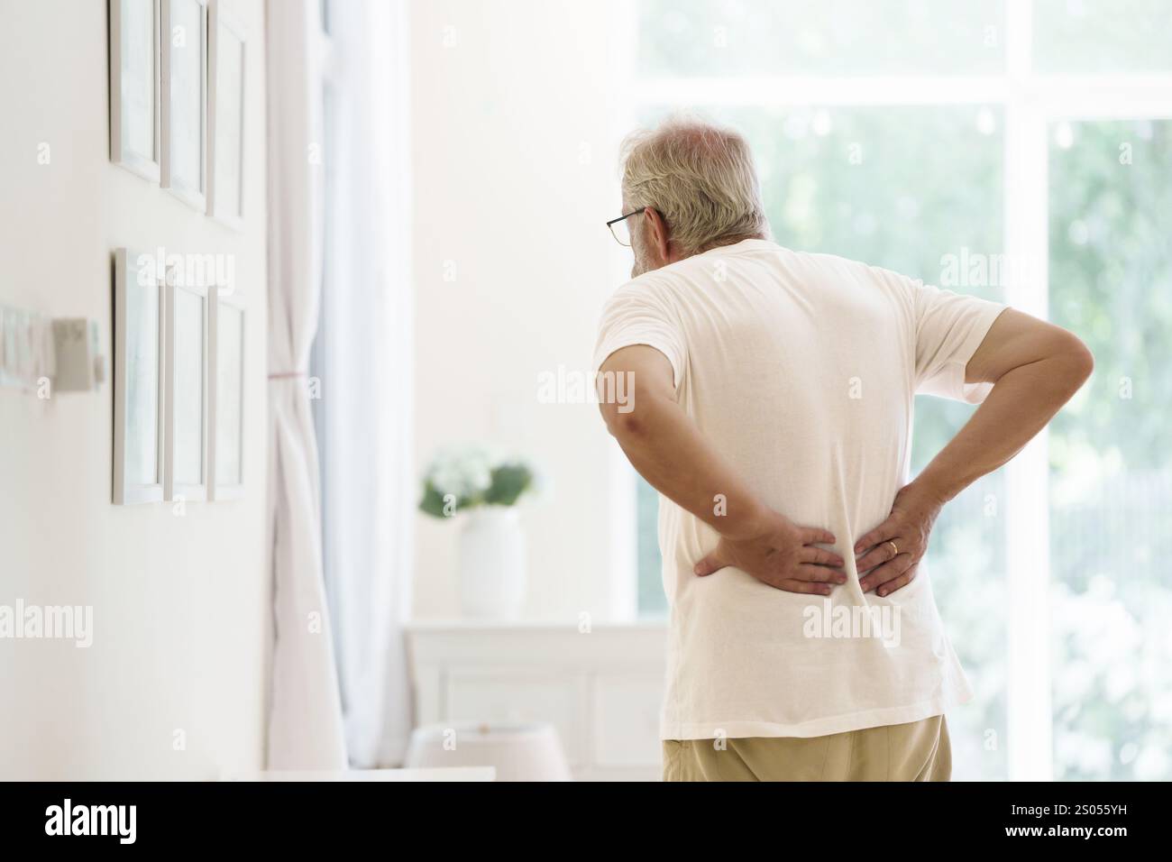 Senior man in pain. Retired man suffering from chest, back and stomach ...