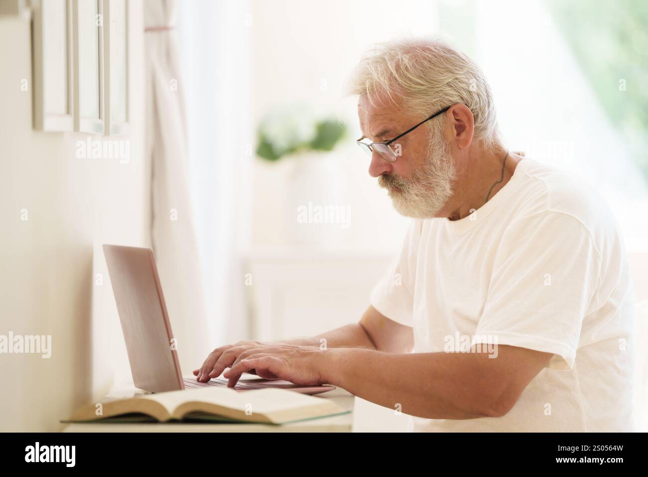 Senior man working on computer. Grandfather having video chat or call ...