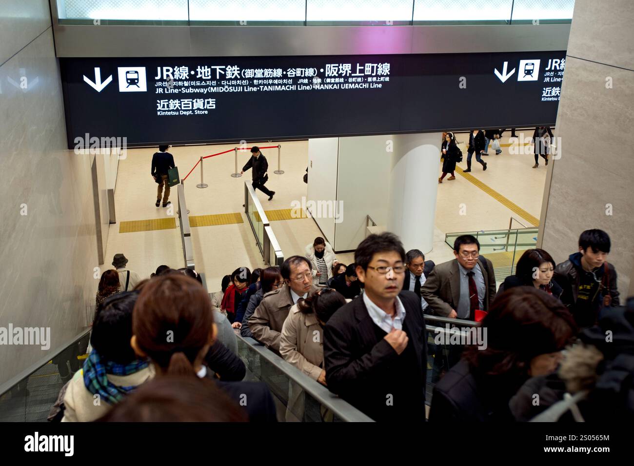 Commuters crowding the stairway and escalators to the underground ...