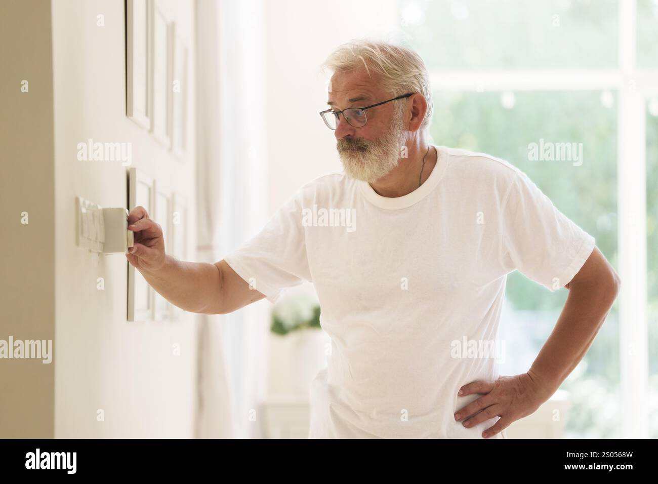 Man adjusting thermostat. Home temperature. House heating and air ...