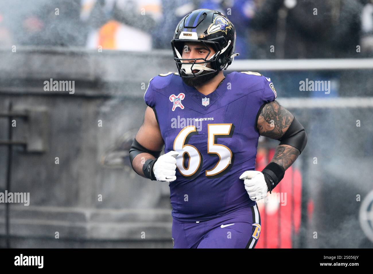 Baltimore Ravens guard Patrick Mekari (65) takes to the field before an ...