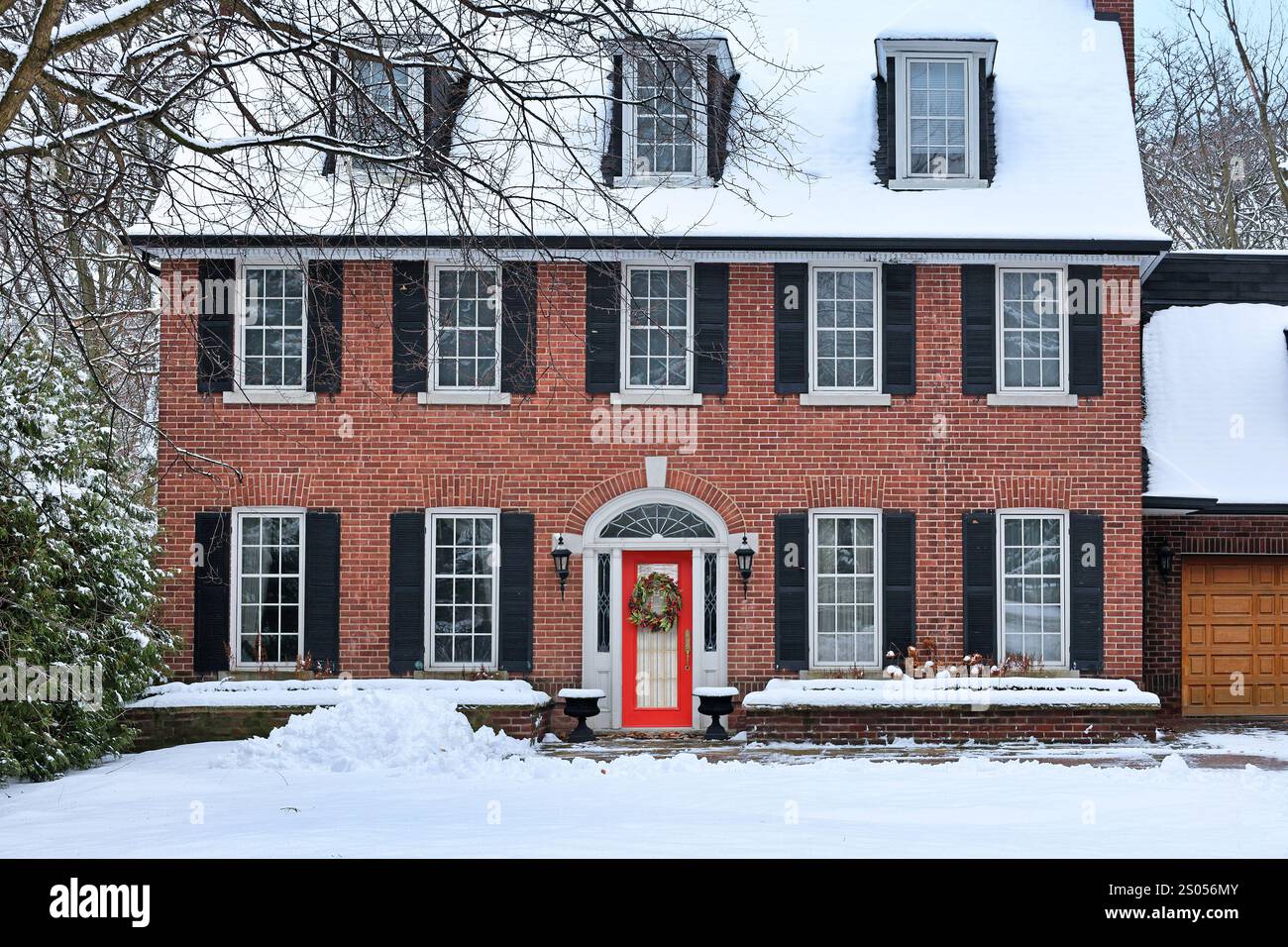 Traditional brick house in winter Stock Photo - Alamy