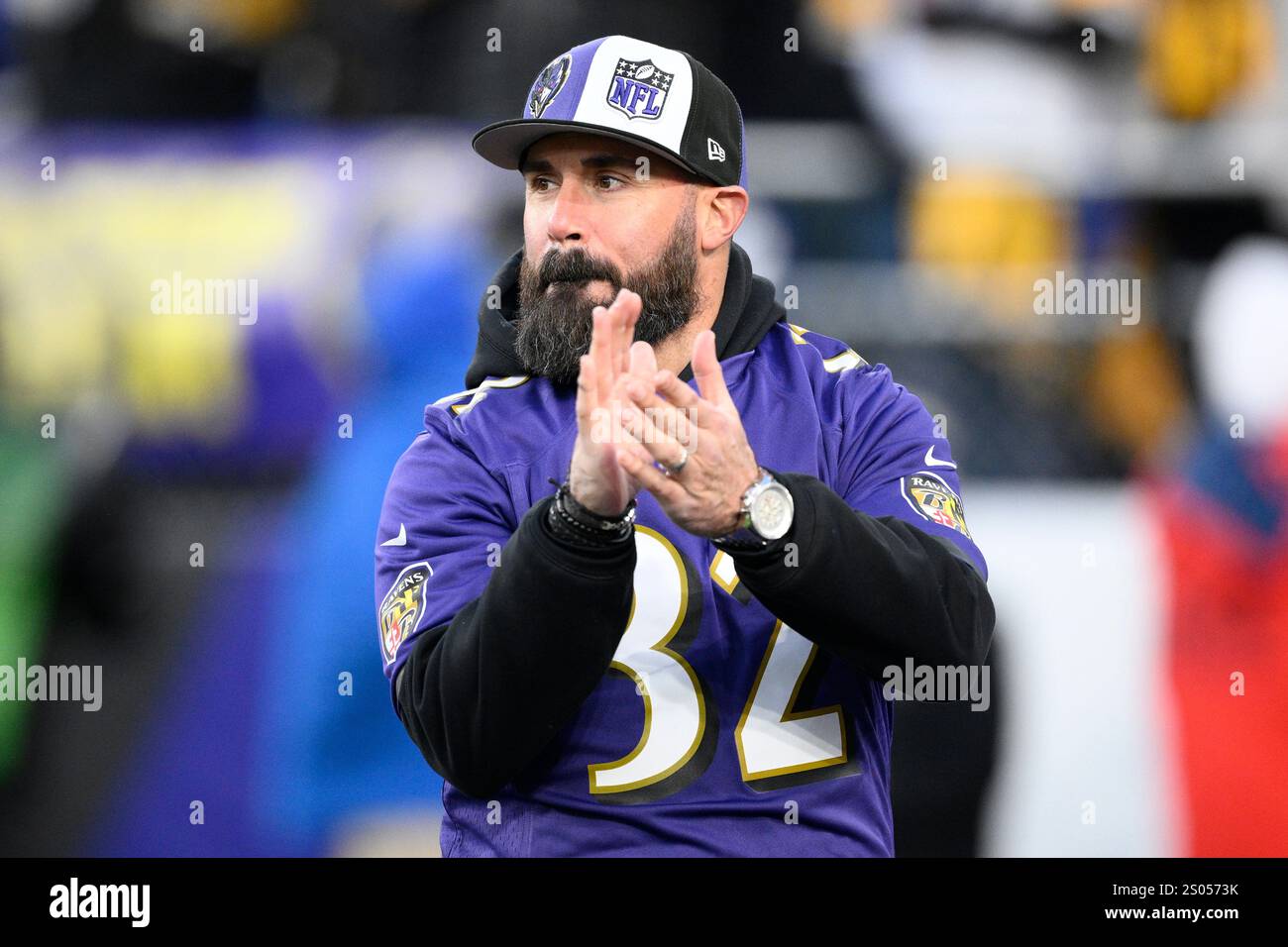 Former Baltimore Raven Eric Weddle reacts before an NFL football game ...