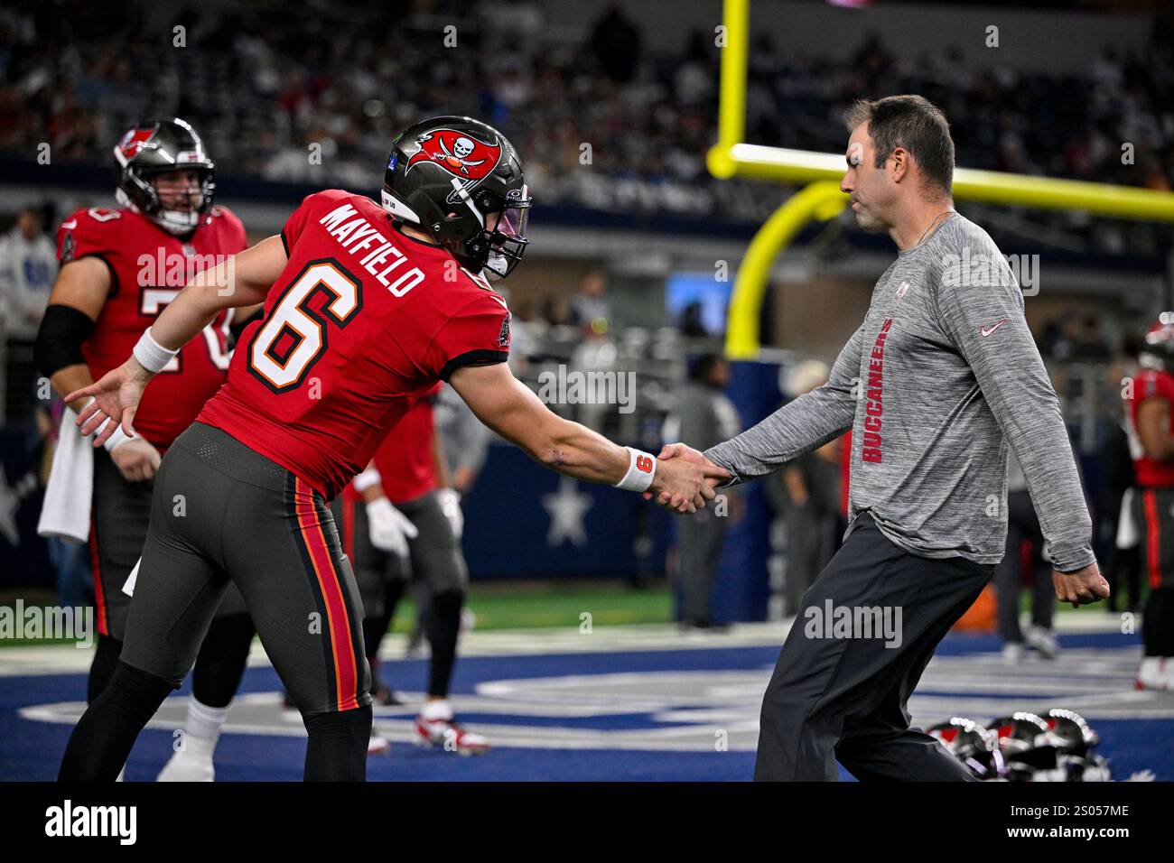Tampa Bay Buccaneers quarterback Baker Mayfield (left) shakes the hand ...