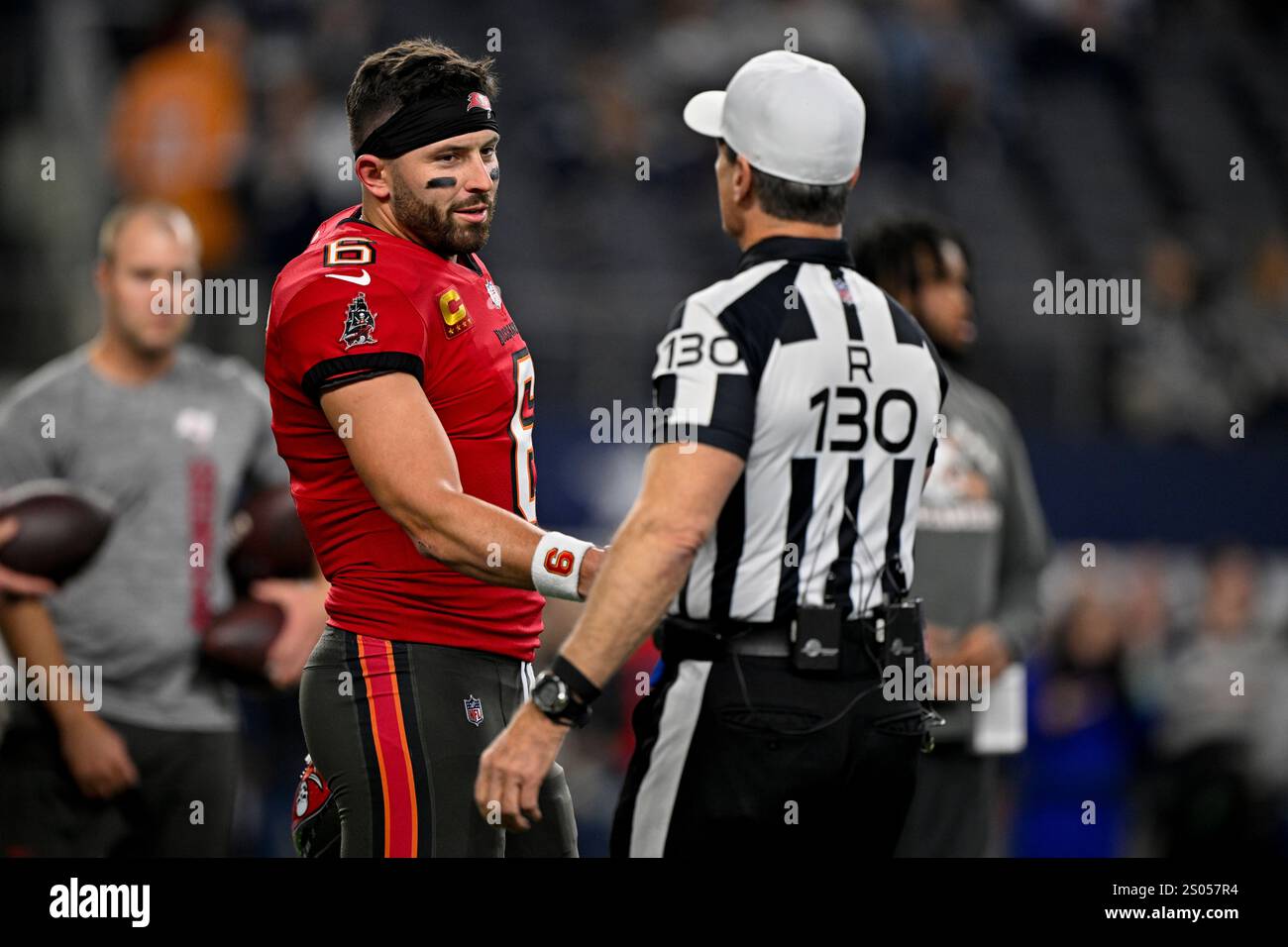 Tampa Bay Buccaneers quarterback Baker Mayfield (left) shakes the hand ...