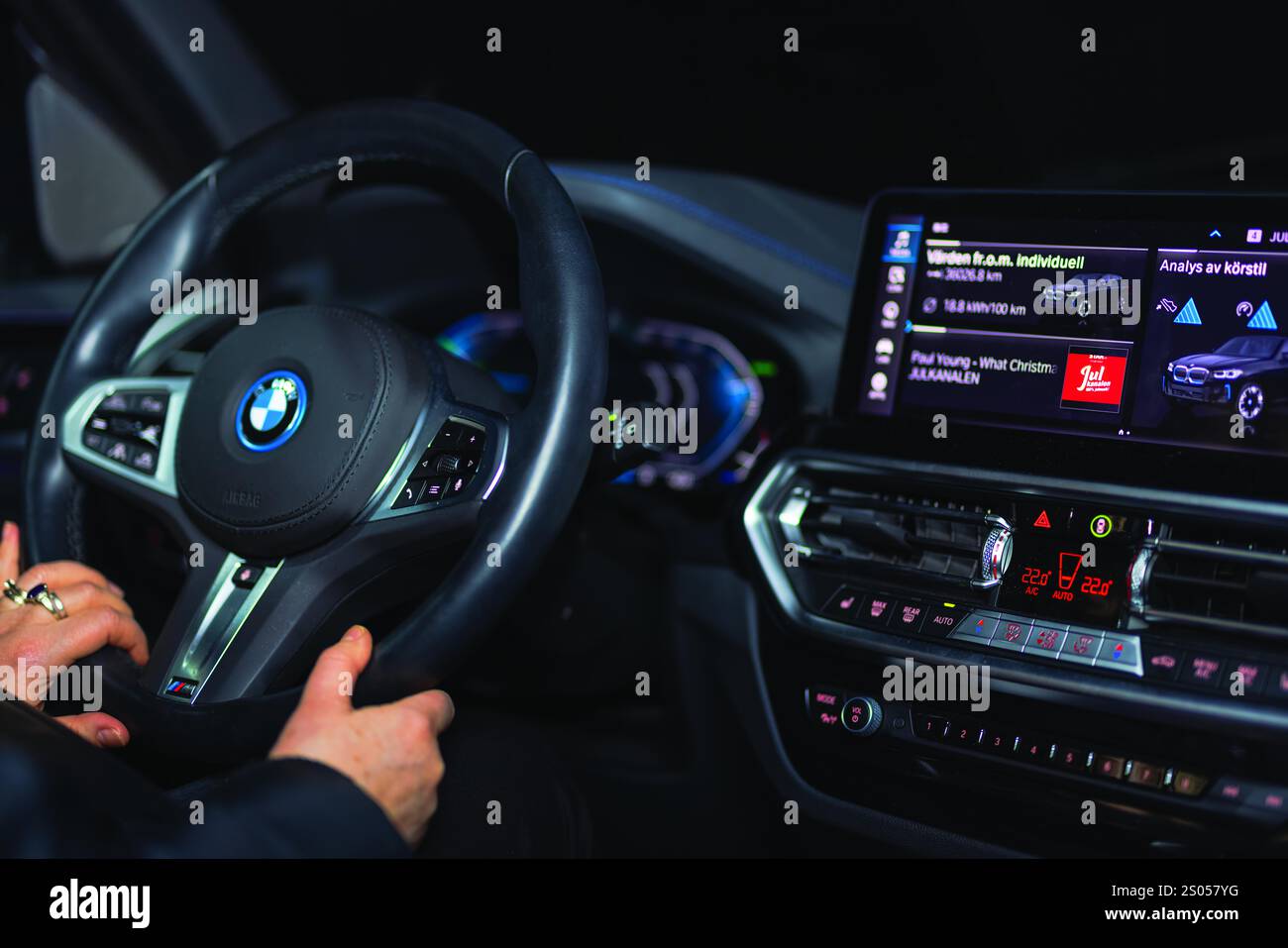 Interior of BMW iX3 electric car showing illuminated steering wheel ...