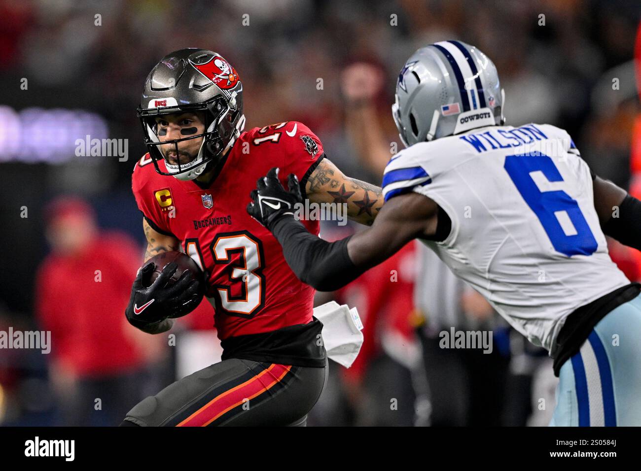 Tampa Bay Buccaneers wide receiver Mike Evans (13) runs with the ball in front of Dallas Cowboys ...