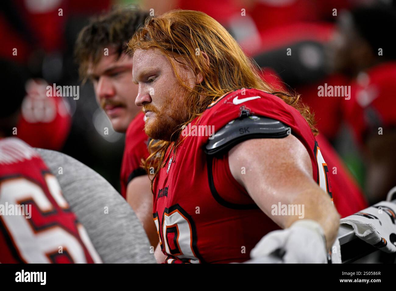 Tampa Bay Buccaneers guard Cody Mauch (69) looks on from the sidelines before an NFL football ...