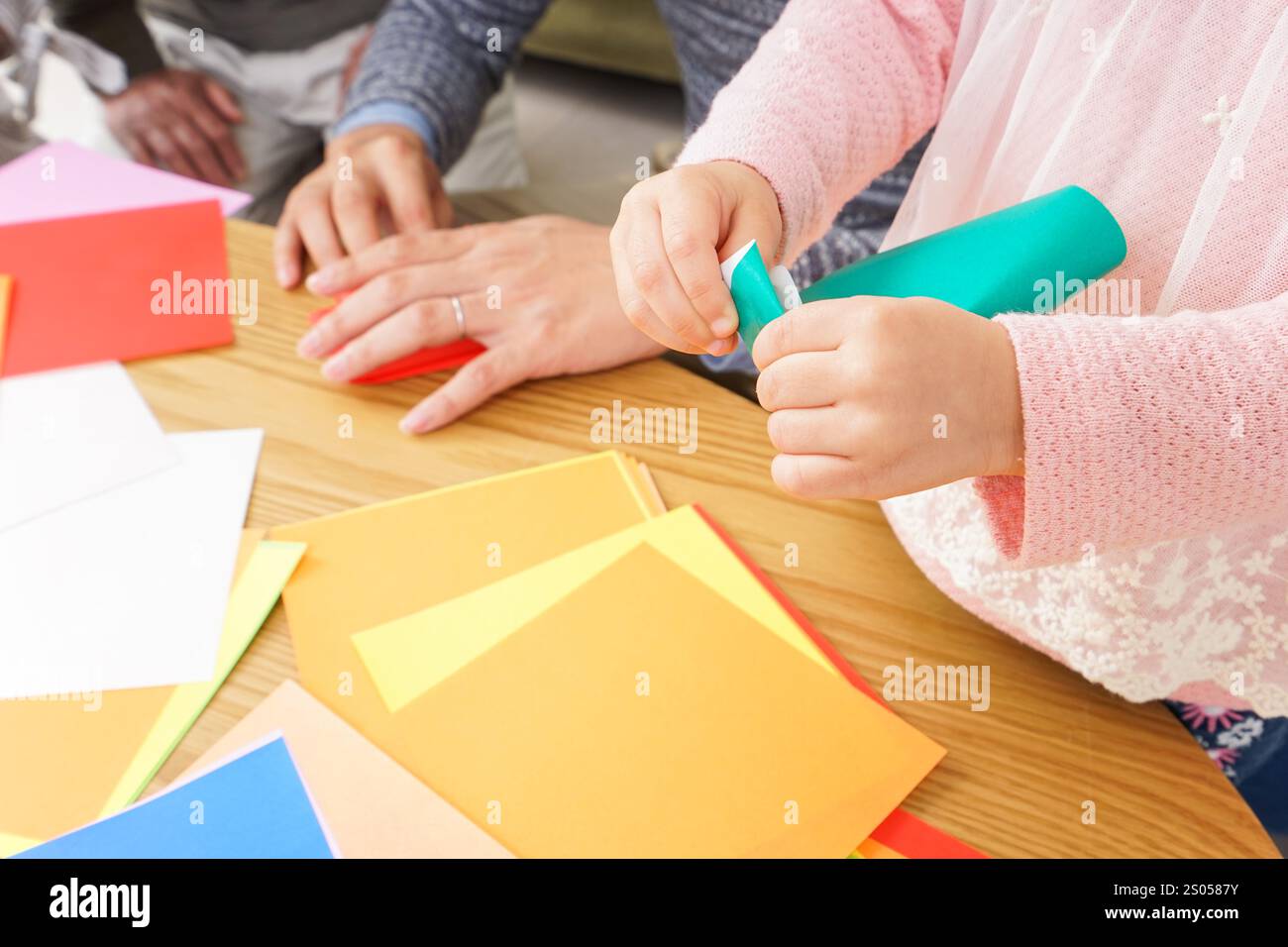Child doing origami Stock Photo - Alamy