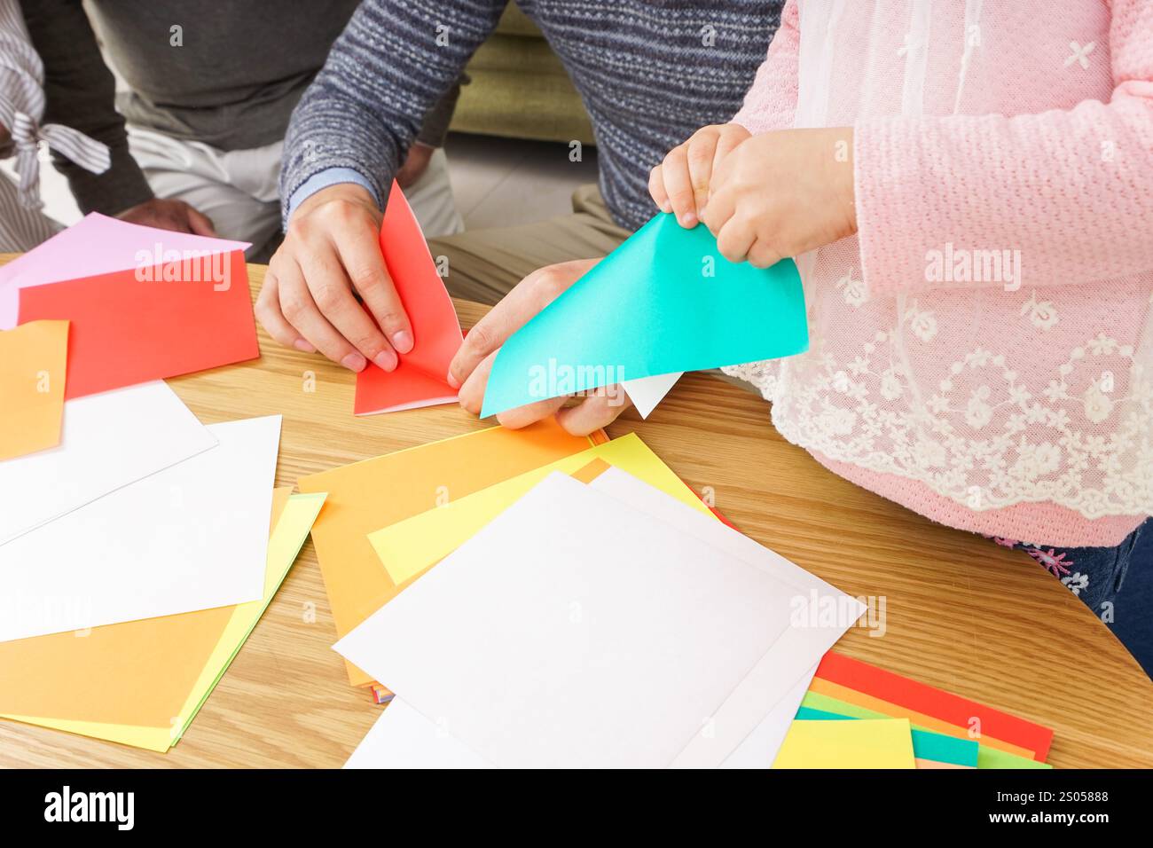 Child doing origami Stock Photo - Alamy