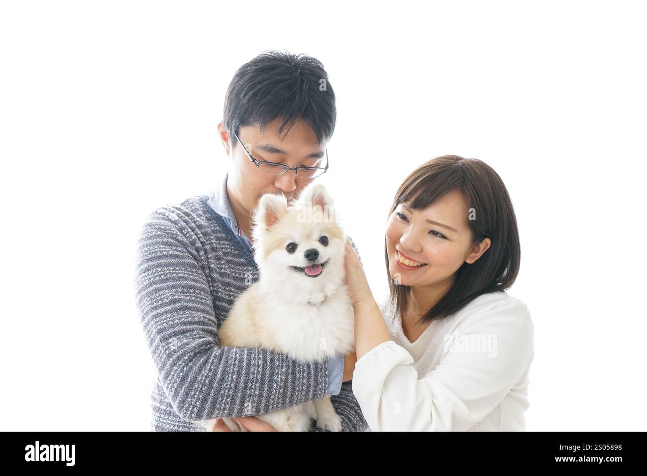 Couple holding dog, couple, breeder, animal welfare Stock Photo - Alamy