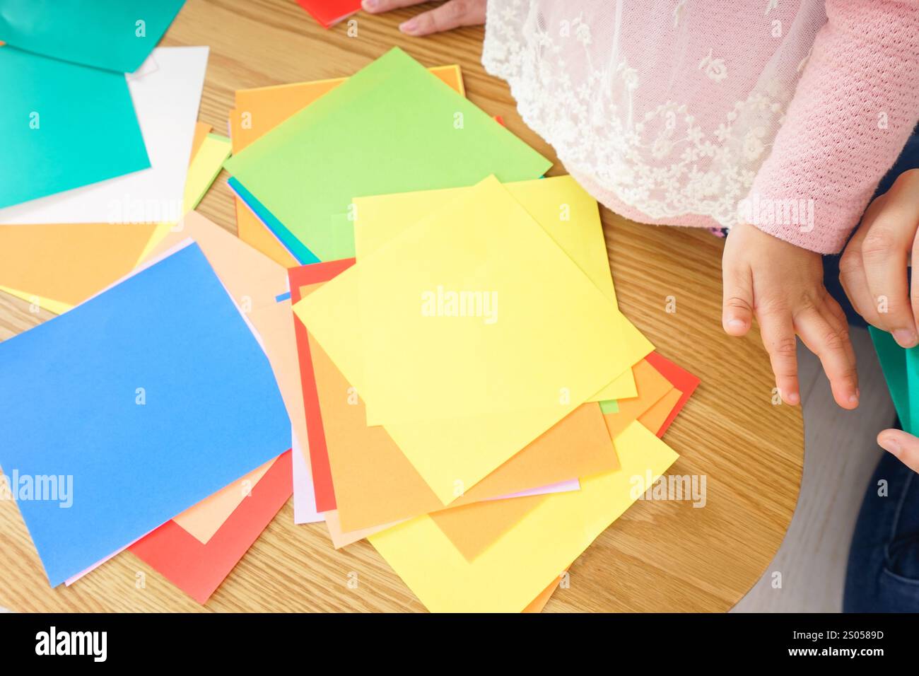 Child doing origami Stock Photo - Alamy