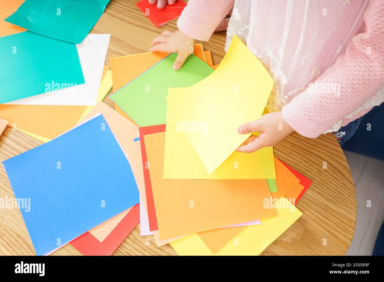 Child doing origami Stock Photo - Alamy