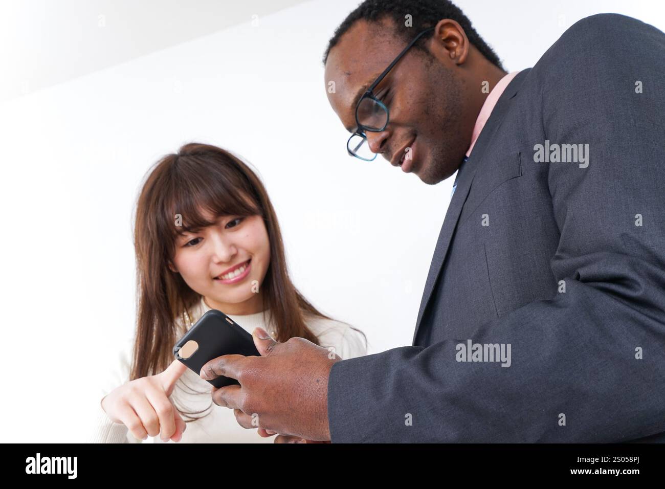 Young woman giving directions to a foreigner Stock Photo - Alamy
