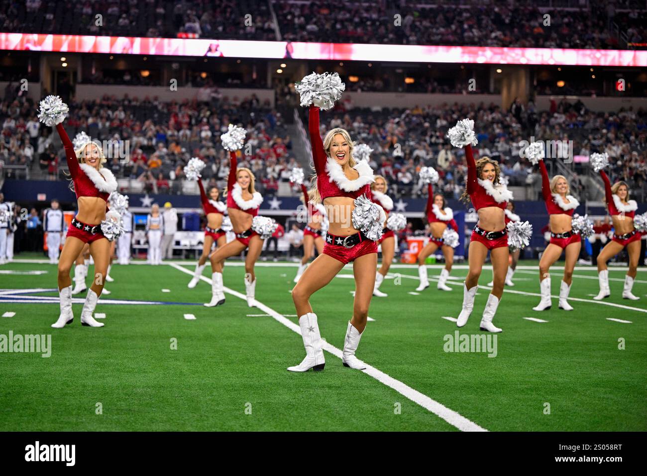 The Dallas Cowboys Cheerleaders perform in their holiday costumes at ...
