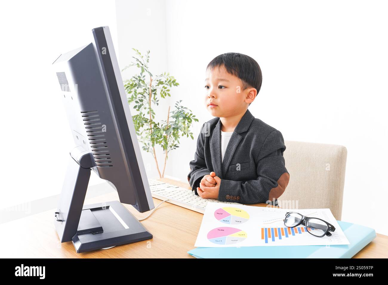 Child businessman working in suit Stock Photo - Alamy