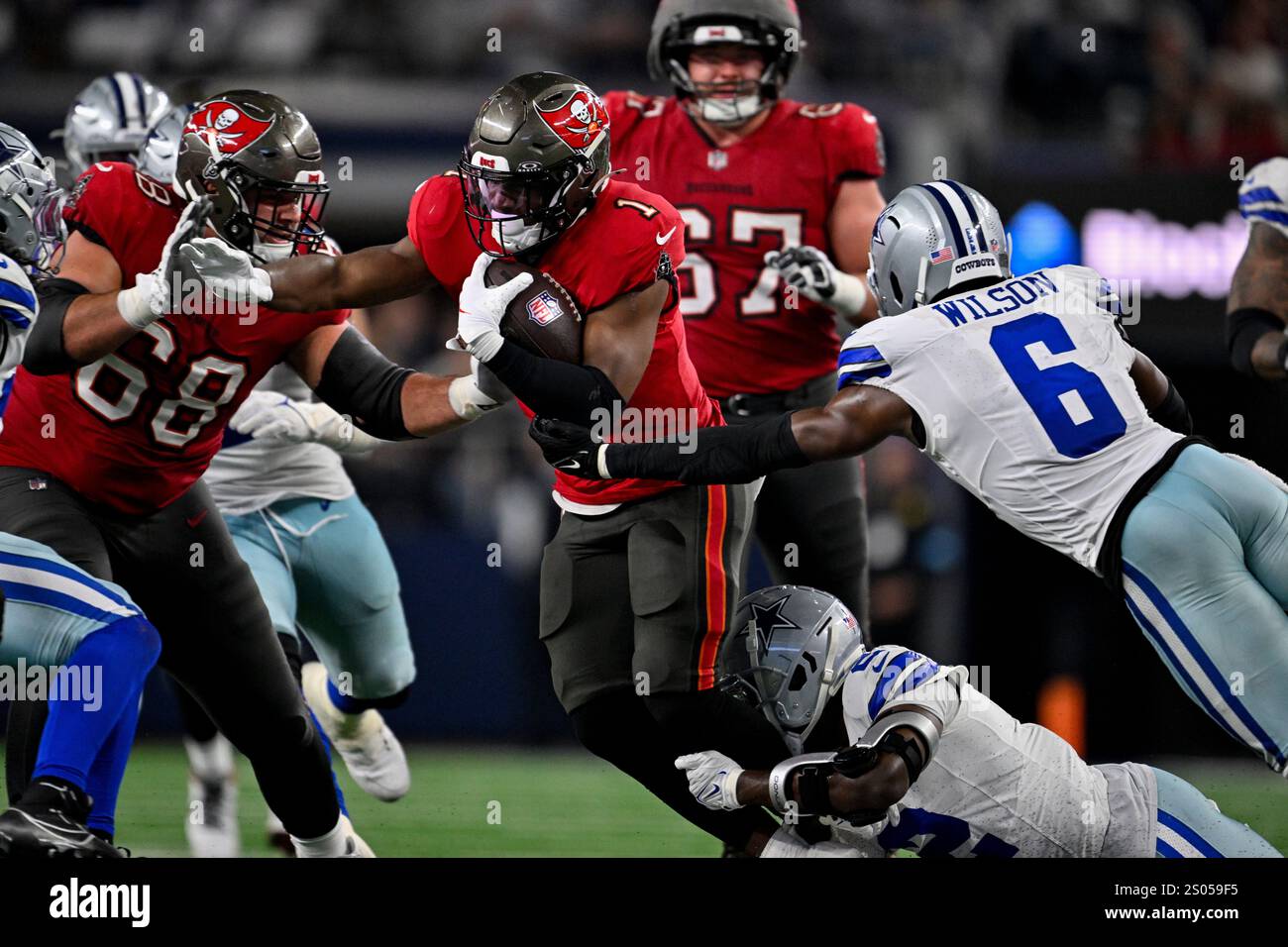 Tampa Bay Buccaneers running back Rachaad White (1) is tackled with ...