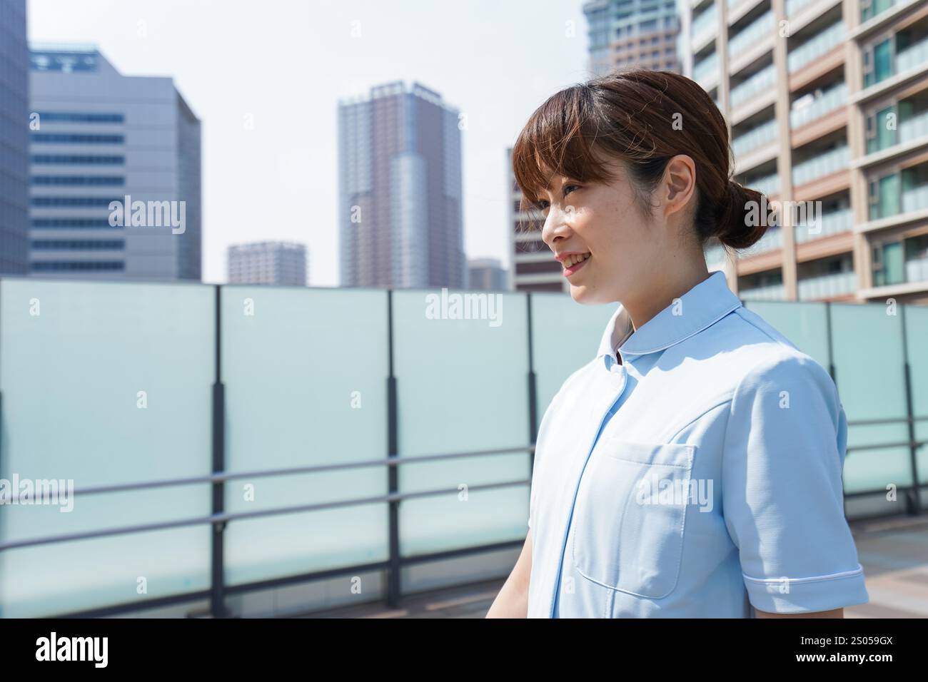 Nurse walking outside Stock Photo - Alamy