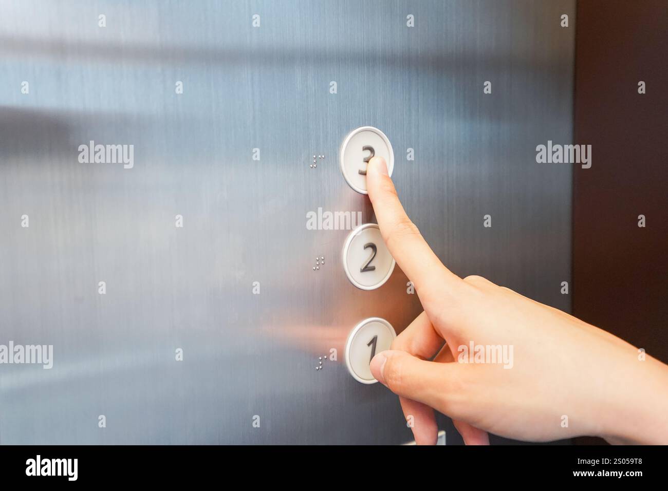 Nurse riding in lift Stock Photo - Alamy