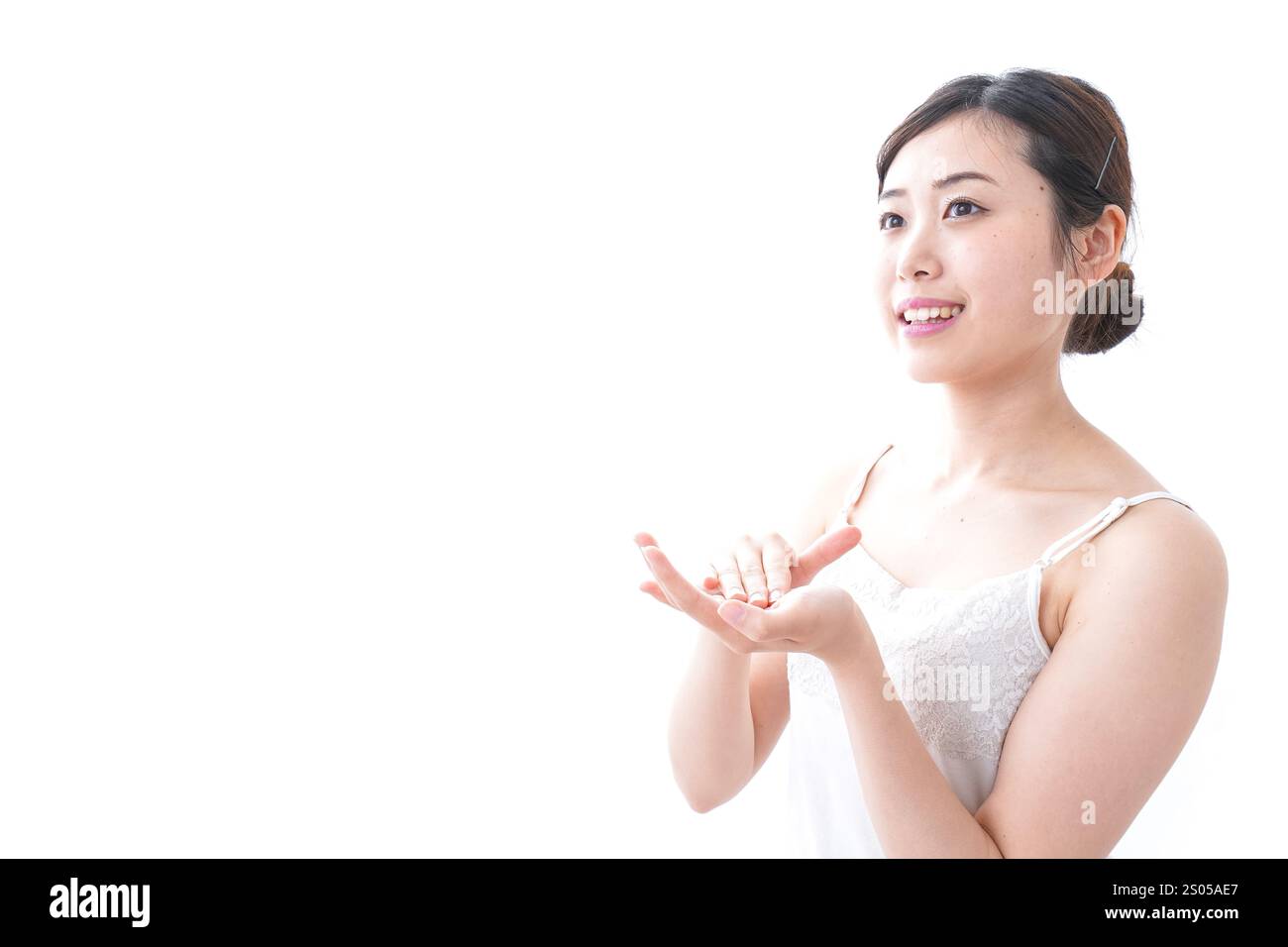 Applying sun lotion to back Cut Out Stock Images & Pictures - Alamy