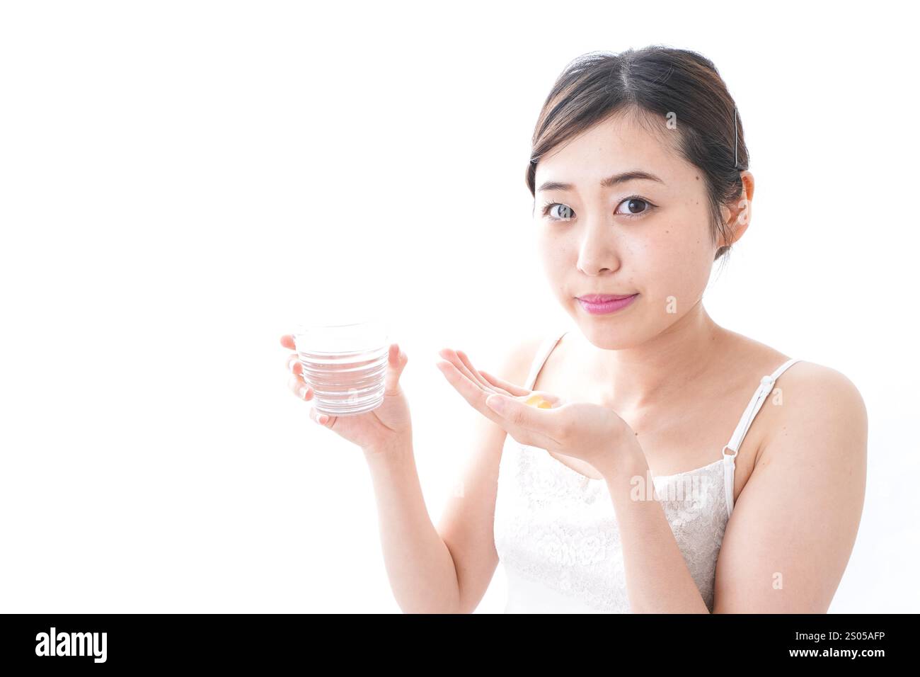 Woman taking medicine Stock Photo - Alamy