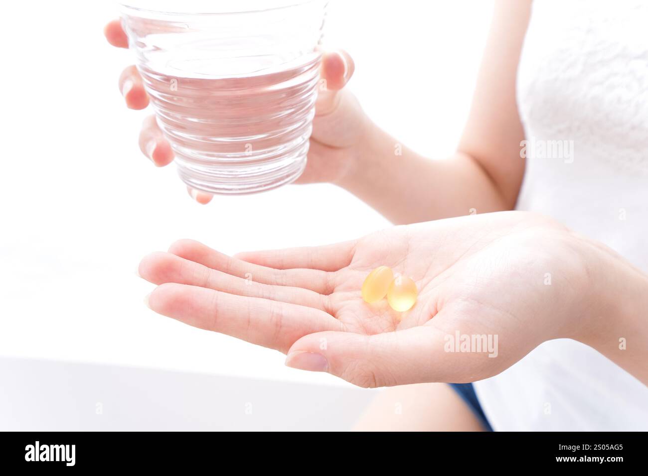 Woman taking medicine Stock Photo - Alamy