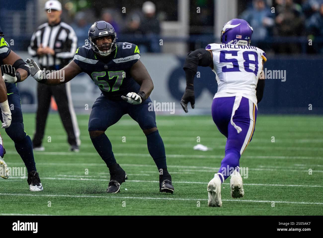 Seattle Seahawks offensive lineman Charles Cross, left, drops into pass ...