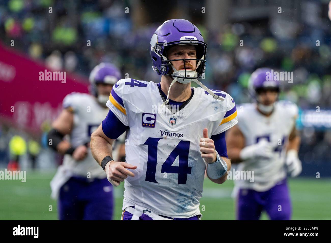 Minnesota Vikings quarterback Sam Darnold jogs off the field during an ...